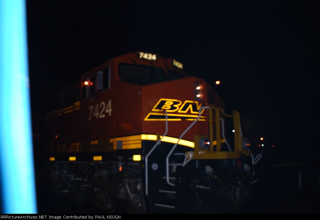 BNSF 7424 rolls by my truck window in the early am.